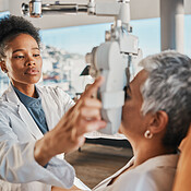 Eye exam, vision and black woman with patient in optometry clinic for ...