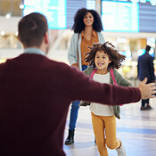 Happy child running to father at airport for welcome home travel and ...