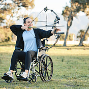 Disabled woman, outdoor archery in wheelchair and challenge with active ...