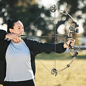 Happy person, bow or arrows aim in sports field, shooting range or ...