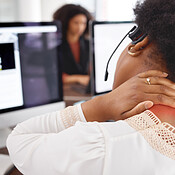 Hand, neck pain and call center with a black woman consultant working ...