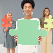 Portrait, staff and black woman with puzzle, team building and planning ...