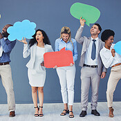 Speech bubble, team and comment by business people holding sign, news ...