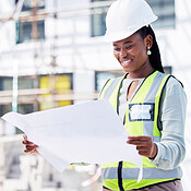 Architect, black woman and blueprint for building at a construction ...