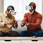 Vr, friends and senior men gaming in home on sofa in living room while ...