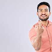 Angry, rude and portrait of an Asian man with a middle finger isolated ...