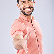 Smile, handshake and portrait of a business man in isolated, gray ...