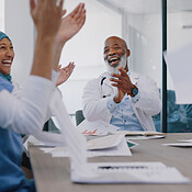 Doctors, applause and high five with success and paper confetti ...