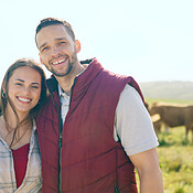 Cow, love and happy couple on a cattle farm hugging, bonding and enjoy ...