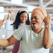 Creative business people, dancing and celebration at office for ...