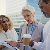 Leadership, senior or business people networking on rooftop in city ...