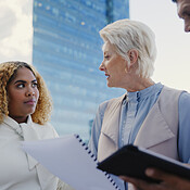 Leadership, senior or business people networking on rooftop in city ...