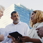 Leadership, senior or business people networking on rooftop in city ...