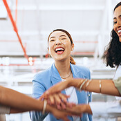 Business team, hands together and celebration of teamwork with women ...