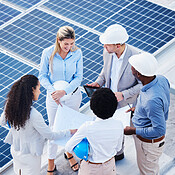 Solar energy, blueprint or engineering team on roof by solar panels for ...