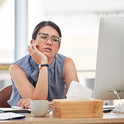 Bored, burnout and a business woman using a computer at work while ...