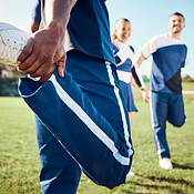 Closeup, outdoor and man stretching, field and fitness for wellness ...