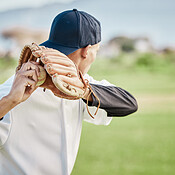 Pitcher, back view or sports man in baseball stadium in a game on ...