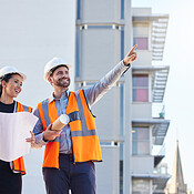 Engineering people and blueprint for outdoor planning, teamwork or ...