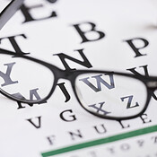 Optometry, letter and healthcare with glasses and chart for focus ...