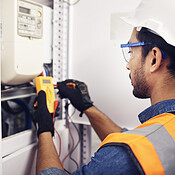 Technician, man and multimeter testing power for electricity, energy ...