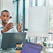 Corporate, black man and team in meeting, brainstorming and feedback ...