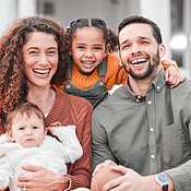 New home, real estate and portrait of a happy family bonding outside a ...