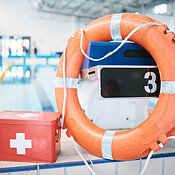 Swimming, equipment and first aid at a pool for security, safety and ...