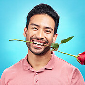 Teeth, flower and rose with portrait of man in studio for celebration ...