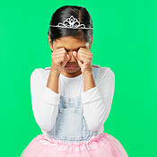 Sad, depression and child crying on green screen with crown, princess ...
