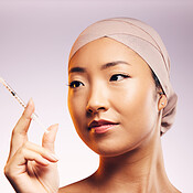 Woman, face and plastic surgery with injection and studio background in ...