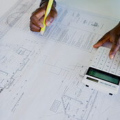 Architect calculator, blueprint and man hands calculating ...