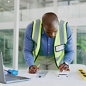 Architecture, laptop and man planning, drawing blueprint lines and ...