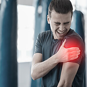 Hand, shoulder pain and the arm of a man in red highlight during a ...