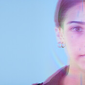 Face overlay, futuristic and woman on studio blue background for ...