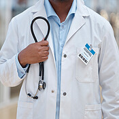 Doctor, person and closeup with stethoscope in hospital for healthcare ...