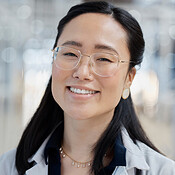 Asian woman, face and happy doctor in hospital for healthcare, wellness ...