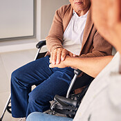 Wheelchair disability, support and elderly people holding hands for ...