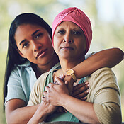 Portrait of mother with cancer, adult daughter in garden and support ...