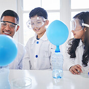 Family, science and father with kids in a laboratory with balloon for ...