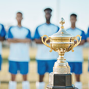 Soccer team, trophy and sports tournament for winning challenge ...