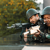 Military, people and gun for training, defense or power on rooftop for ...