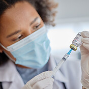 Smallpox, vaccine and vial with doctor, needle and healthcare safety in ...