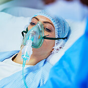 Hospital, anesthesia and woman with oxygen mask in surgery for medical ...