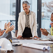 Applause, talking and construction workers in a meeting with a manager ...