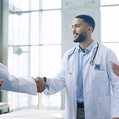 Meeting, applause or doctors shaking hands for success, good job or ...