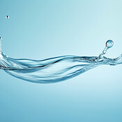 Close up of water splash. Fresh spring mineral water for hydration and ...
