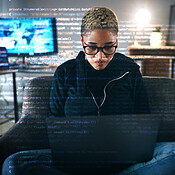 Serious woman, code overlay and laptop typing with cybersecurity ...