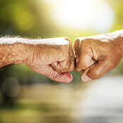 Support, nature and a fist bump for fitness motivation, solidarity or ...
