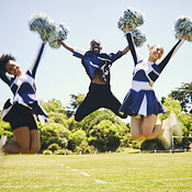 Cheerleader team, smile and people jump for performance on field ...